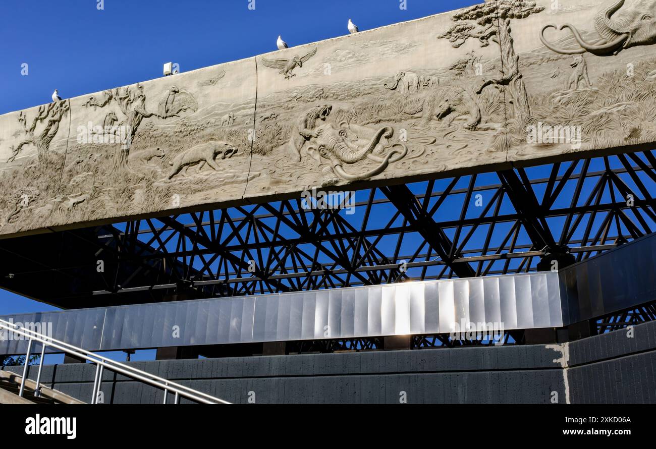 Decorative carvings of prehistoric scenes and animals on the exterior ...