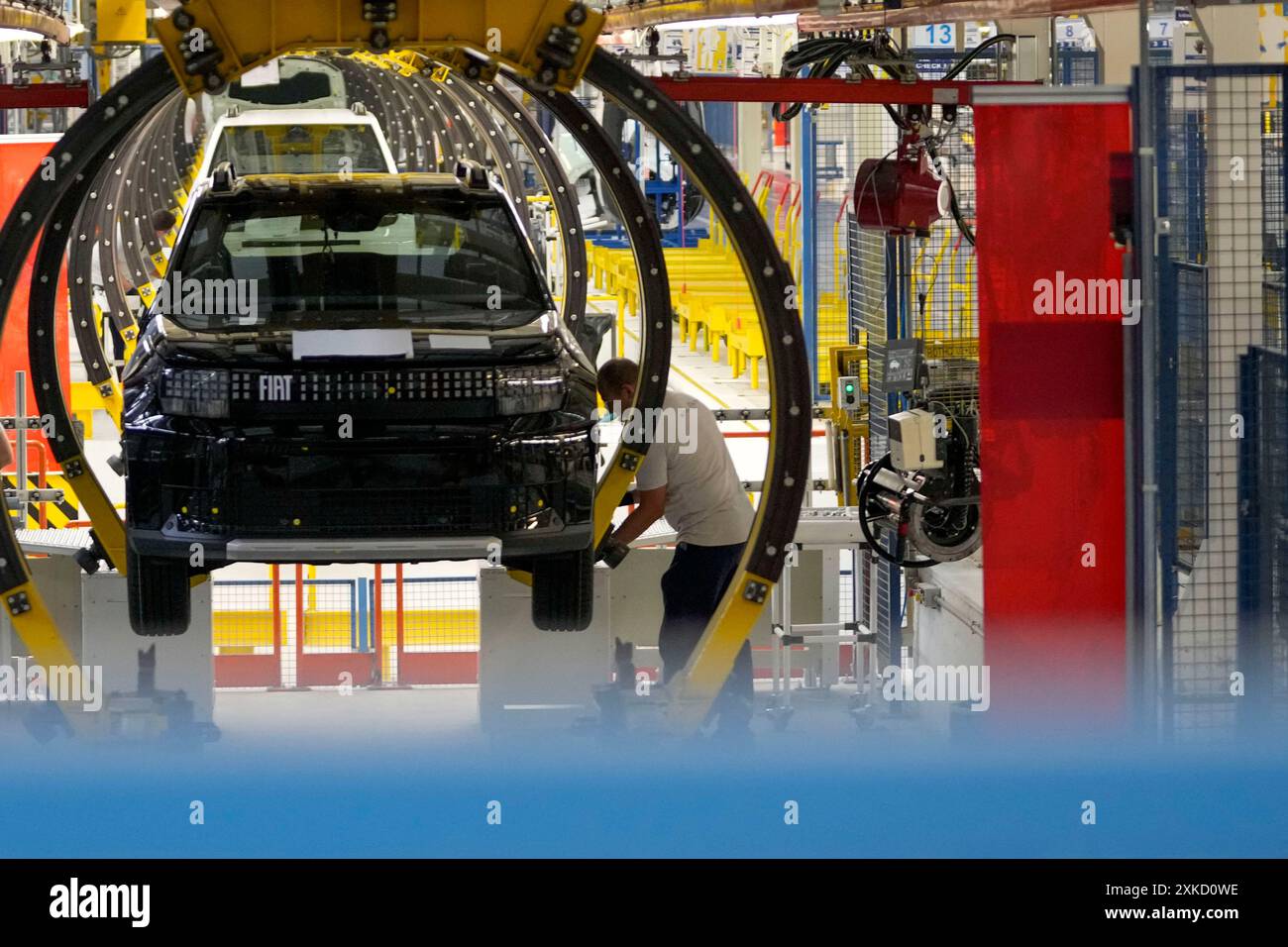 A Serbian factory worker prepares an all-new Fiat Grande Panda car in ...