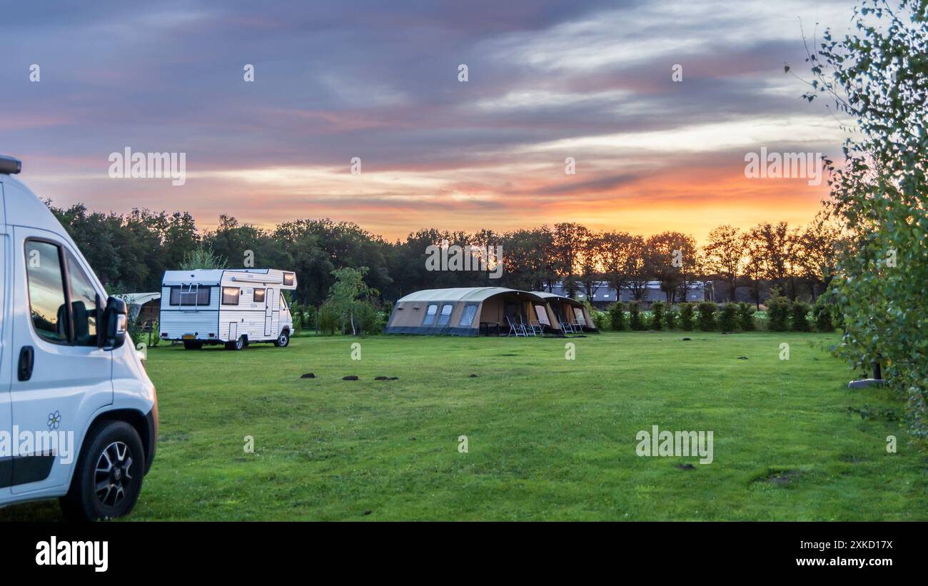 Panorama landscape with beautiful sunset at farm campsite with family ...