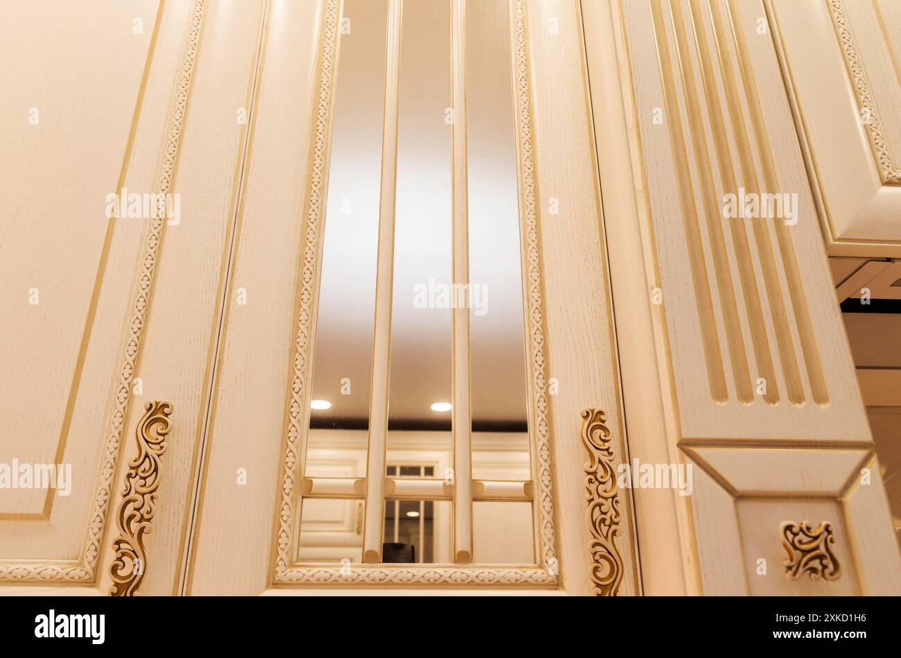 Close-up of a decorative kitchen cabinet panel with intricate designs ...