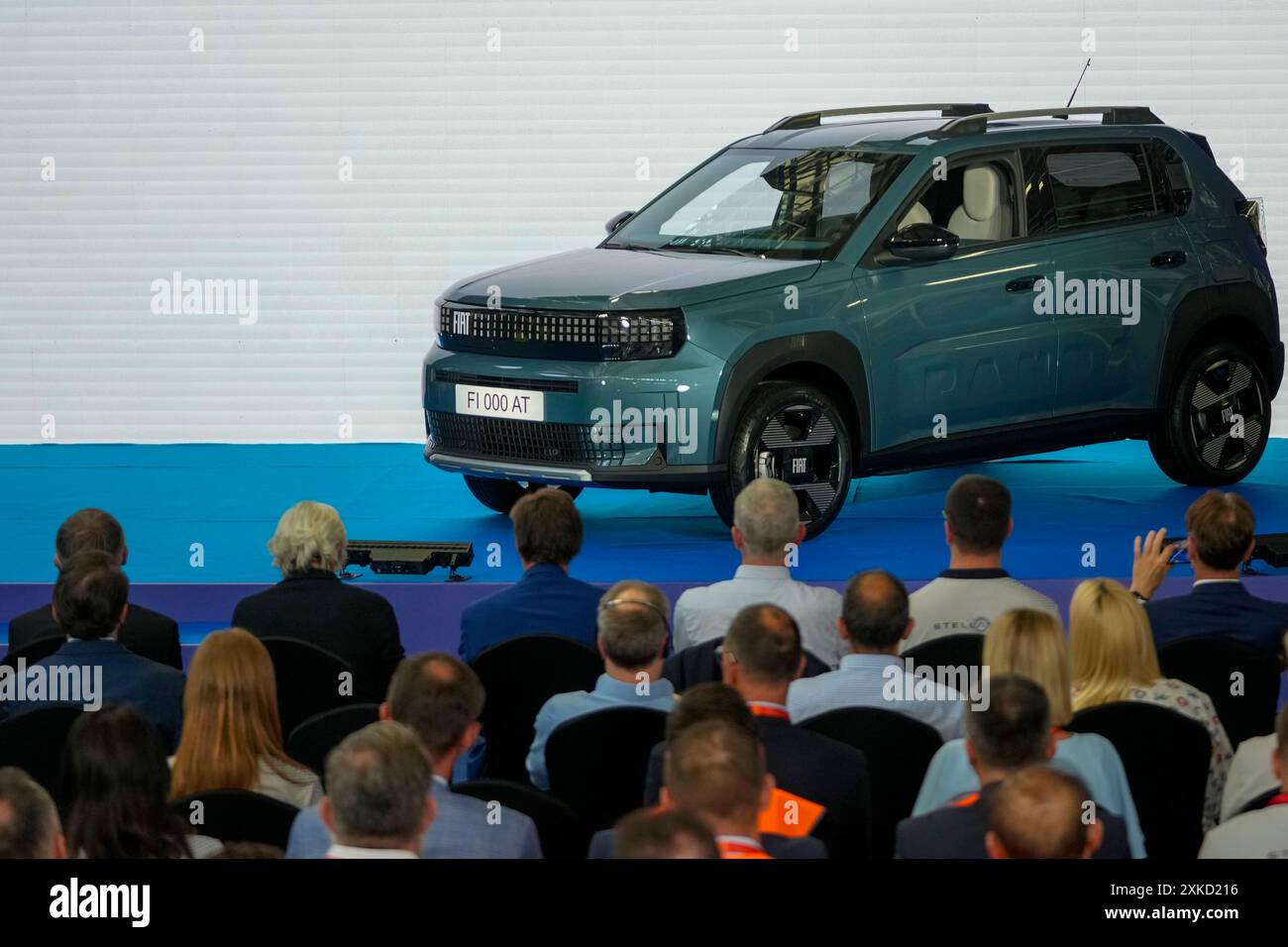 Guests watch an all-new Fiat Grande Panda car in the assembly hall in ...