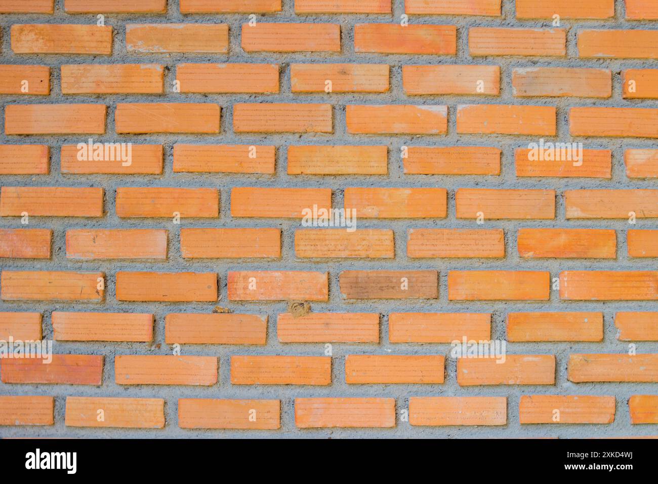 Brick wall background is a wall made of clay bricks, giving the ...