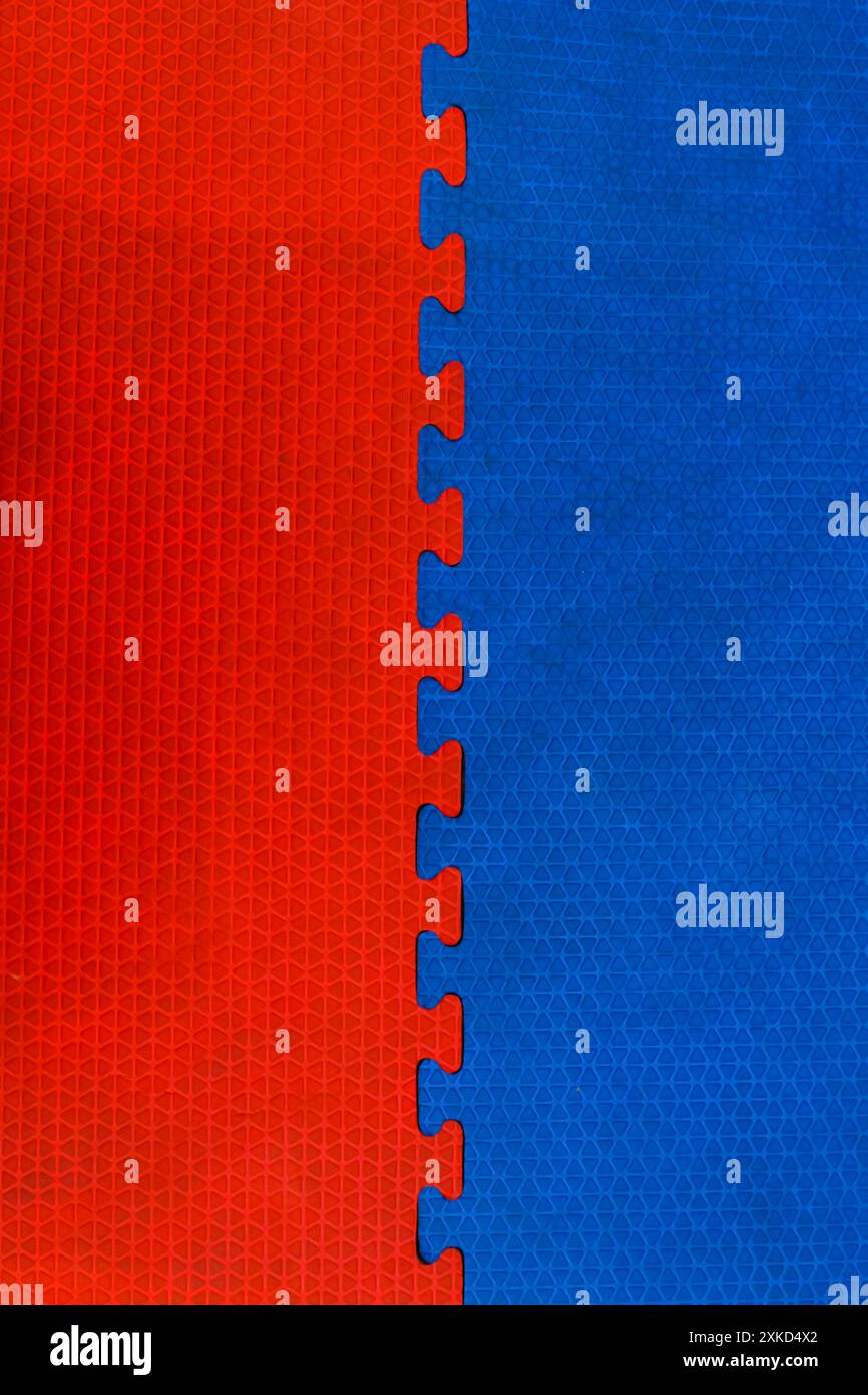 Easily interlocking puzzle shaped rubber floor mats to prevent falling ...