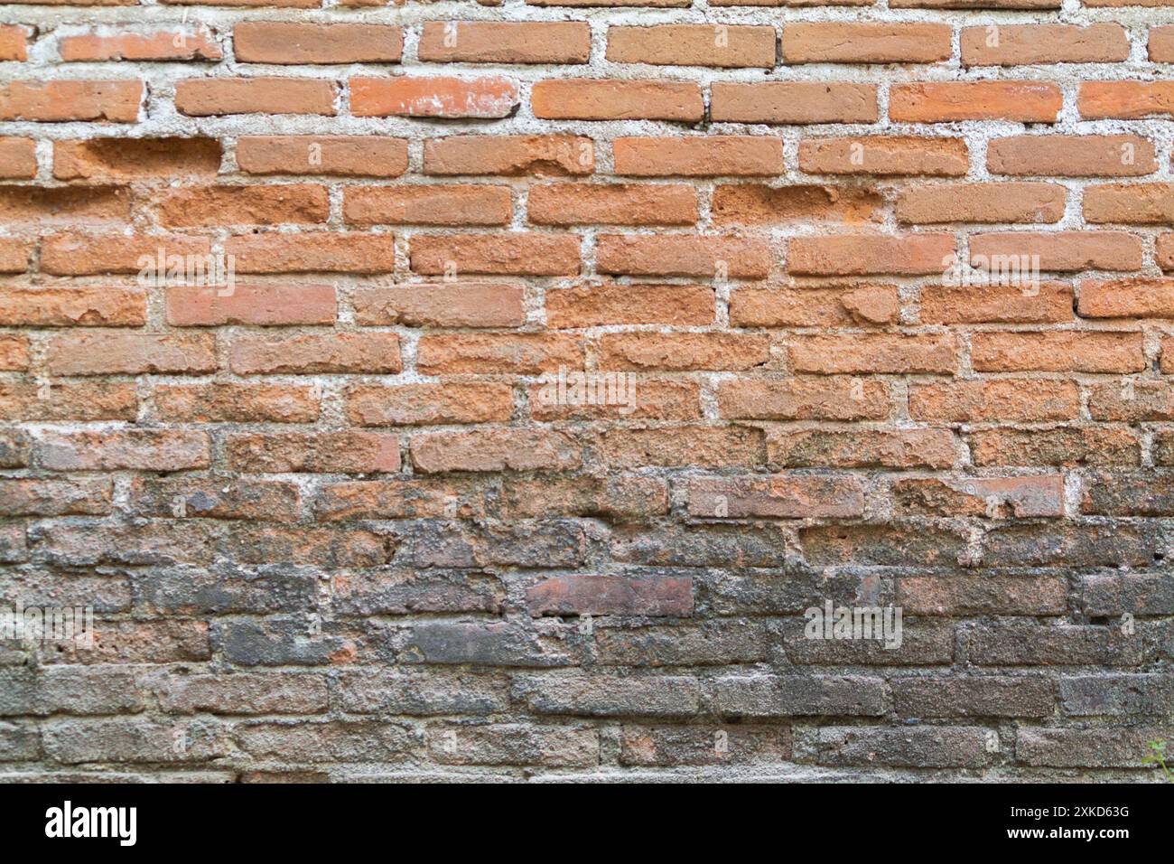 Brick wall background is a wall made of clay bricks, giving the ...