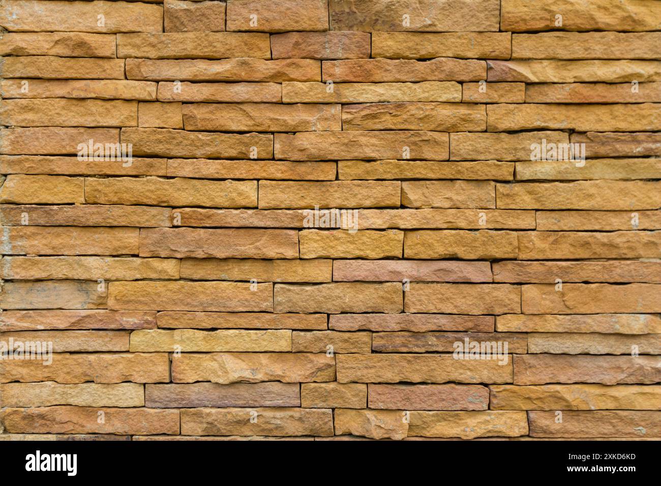 Brick wall background is a wall made of clay bricks, giving the ...