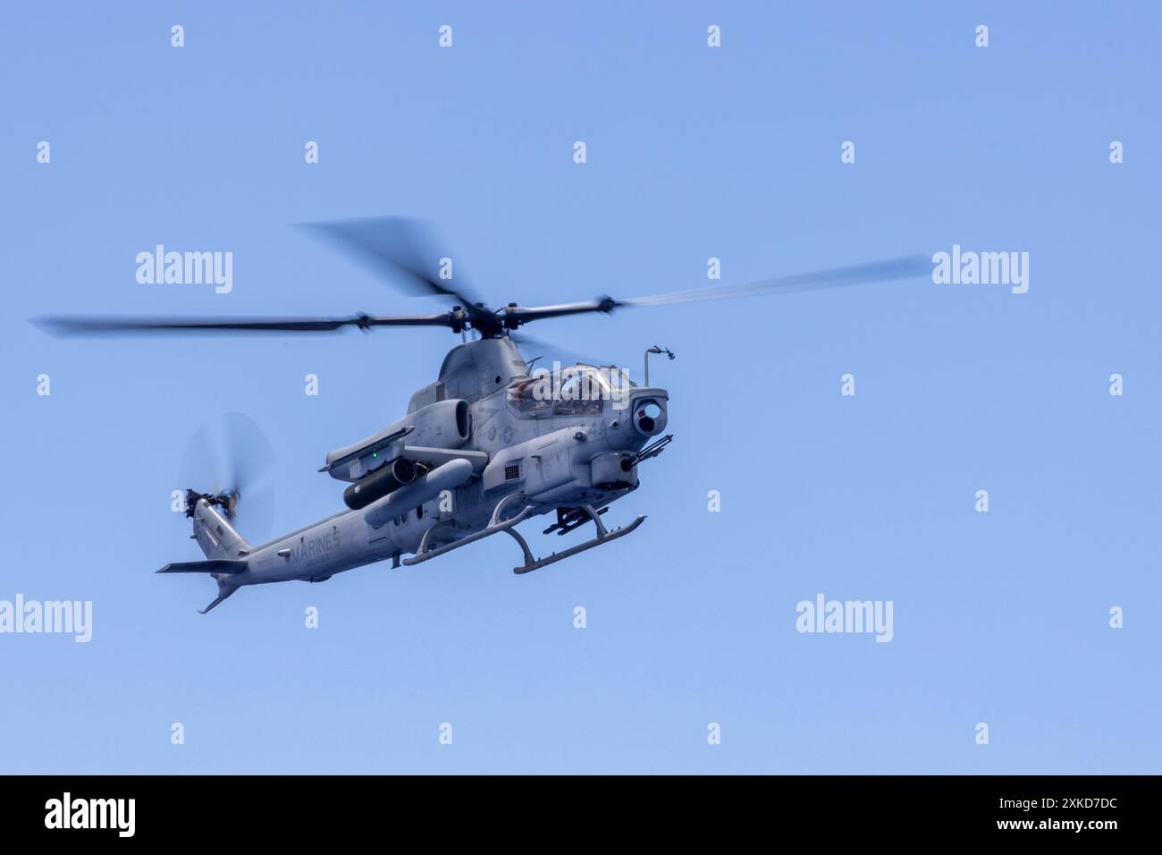 A U.S. Marine Corps AH-1Z Viper helicopter with Marine Medium Tiltrotor ...
