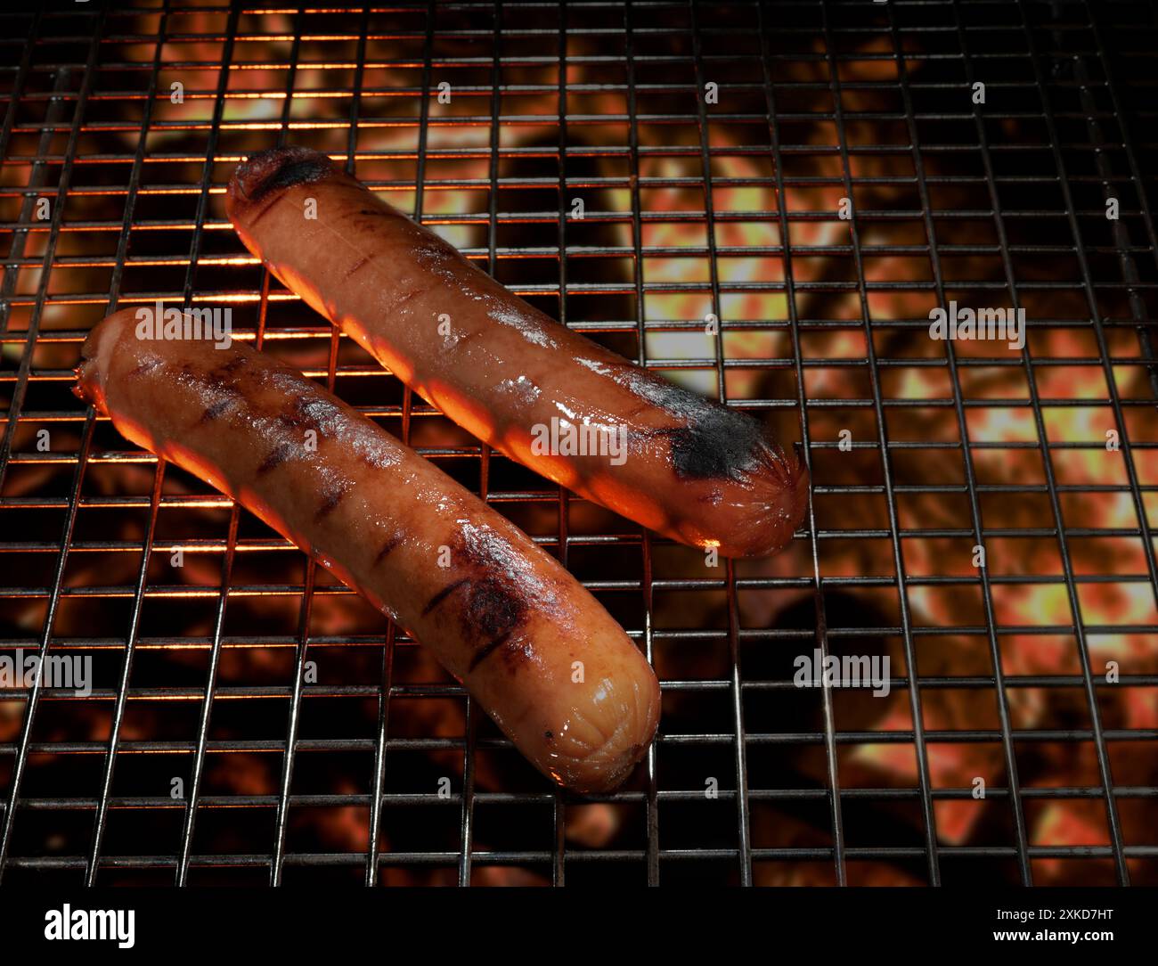 Hot dogs cooking over a fire Stock Photo - Alamy