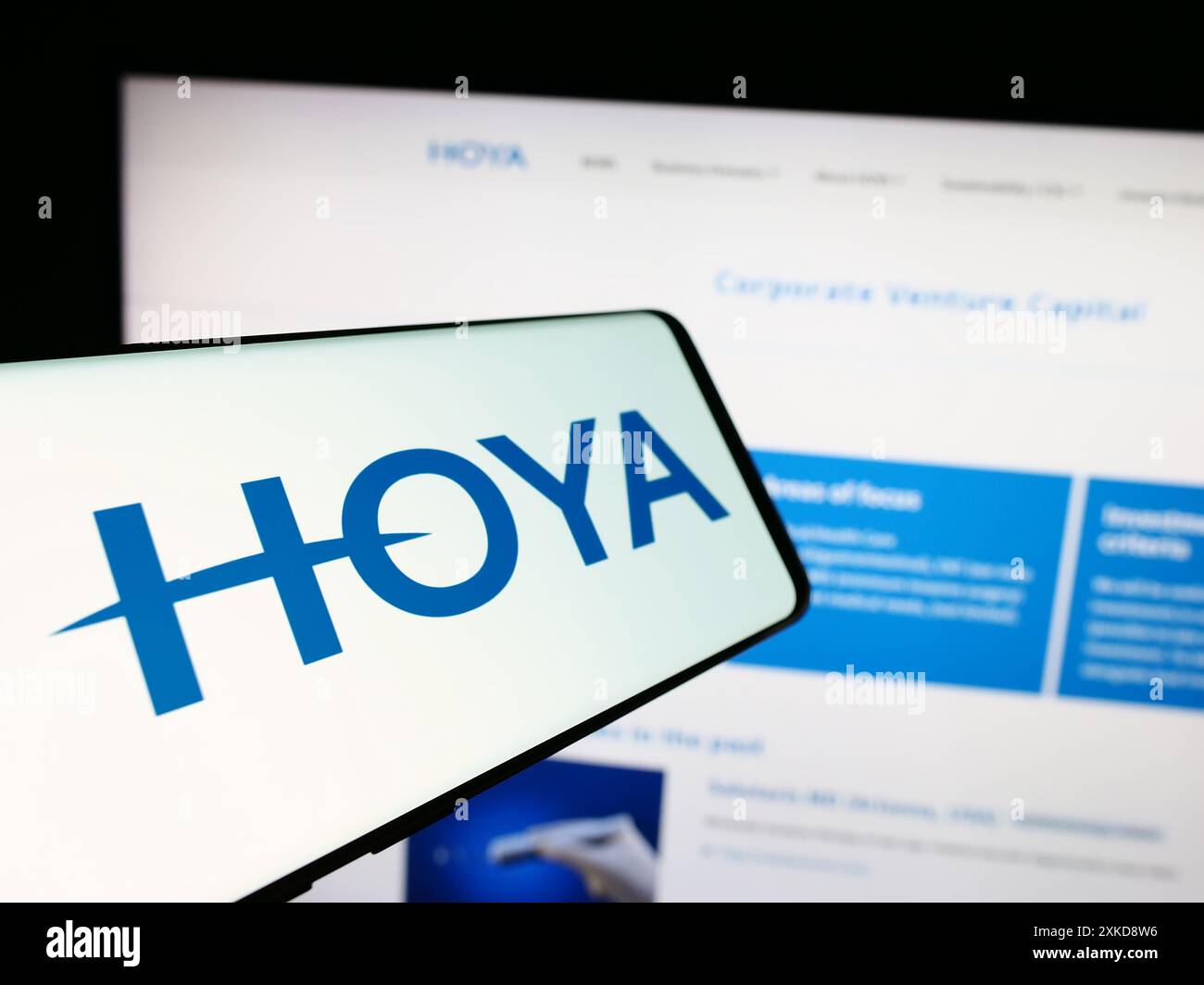 Smartphone with logo of Japanese precision instruments company Hoya ...