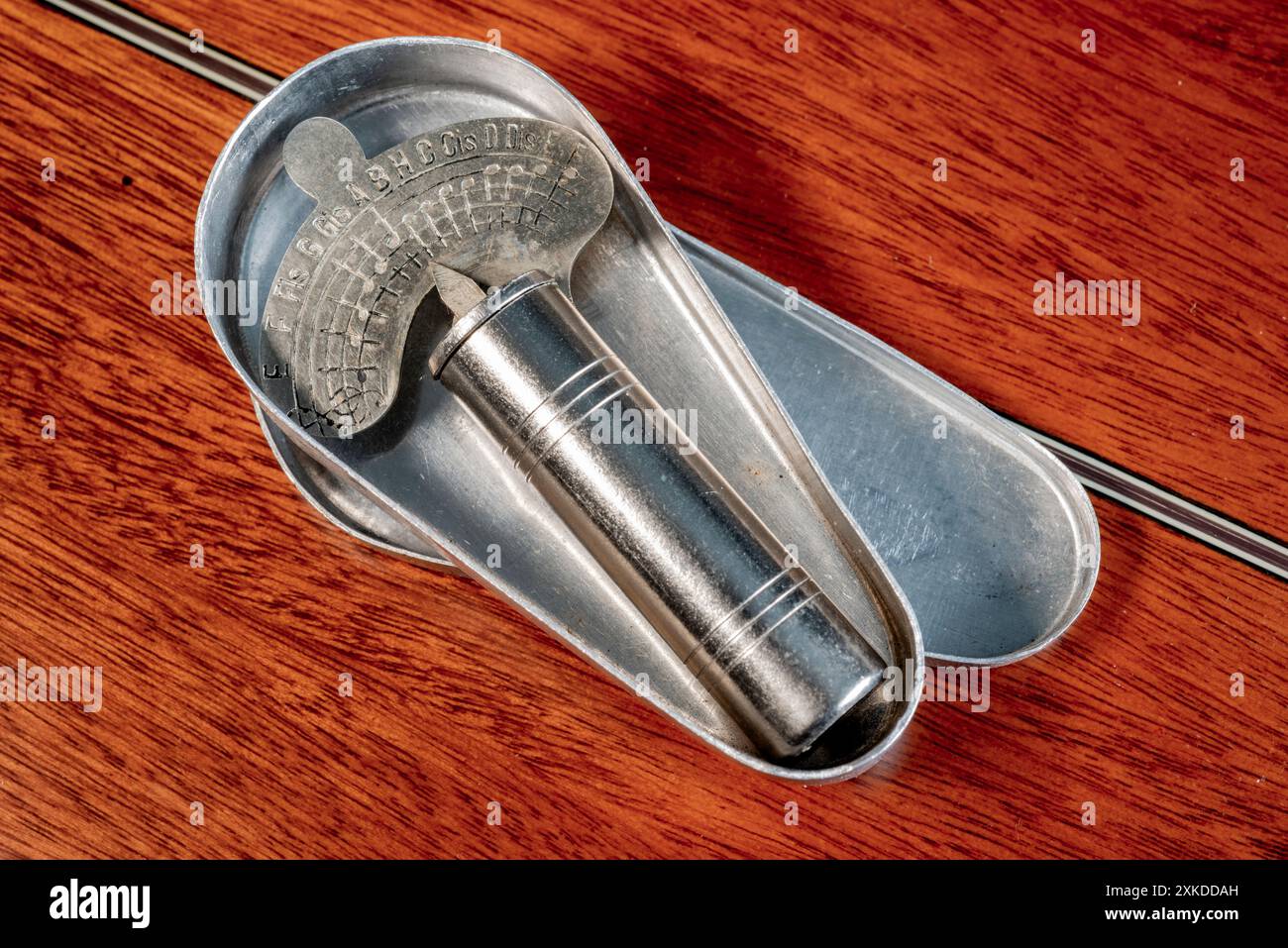 Vintage Variable metal chromatic guitar tuning pitch pipes resting on ...