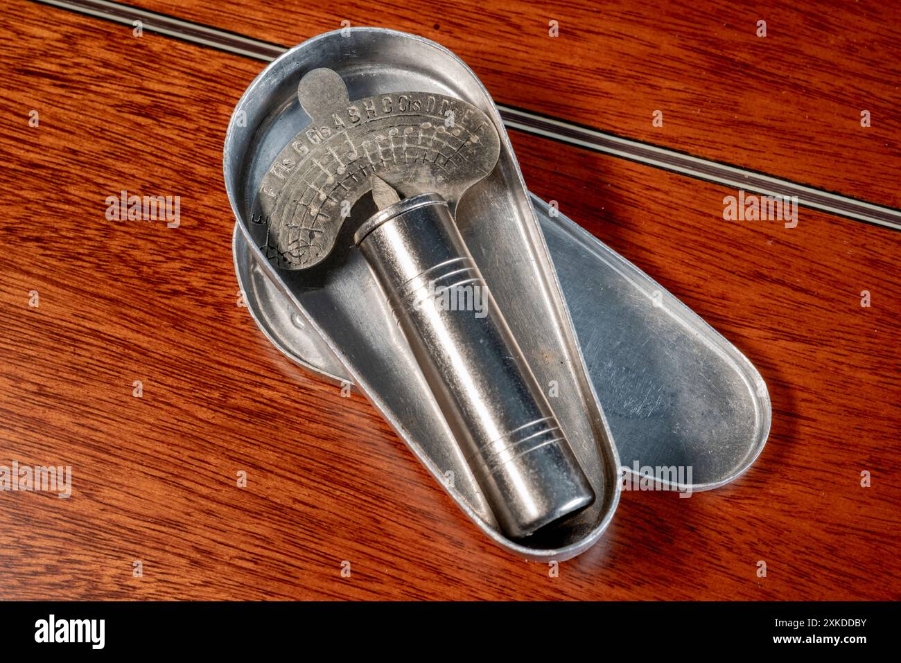 Vintage Variable metal chromatic guitar tuning pitch pipes resting on ...