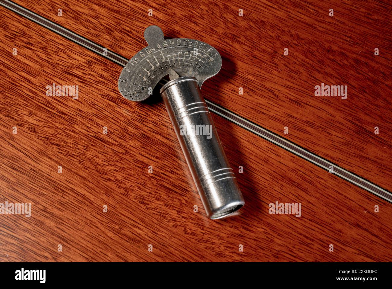 Vintage Variable metal chromatic guitar tuning pitch pipes resting on ...