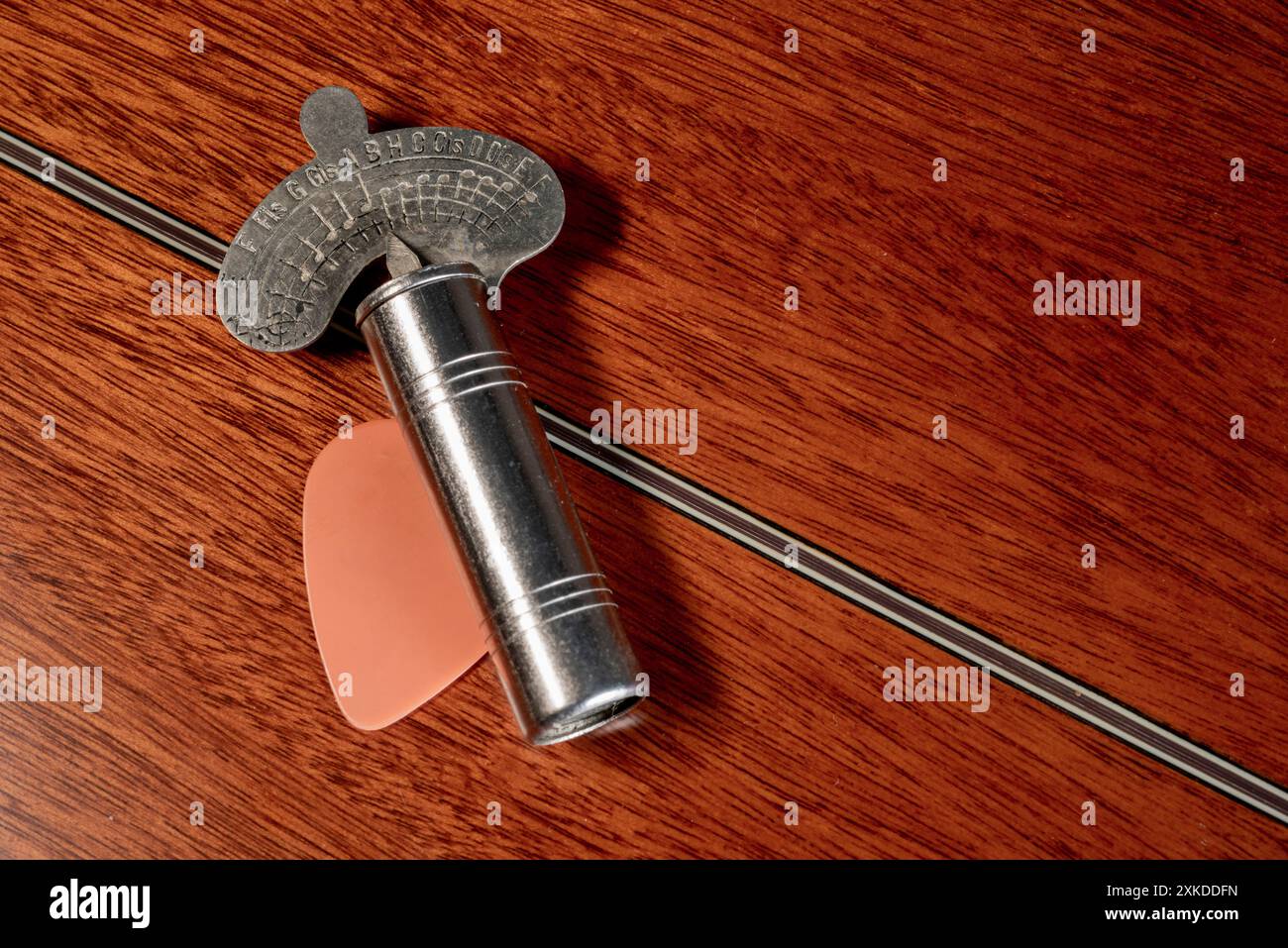 Vintage Variable metal chromatic guitar tuning pitch pipes resting on ...