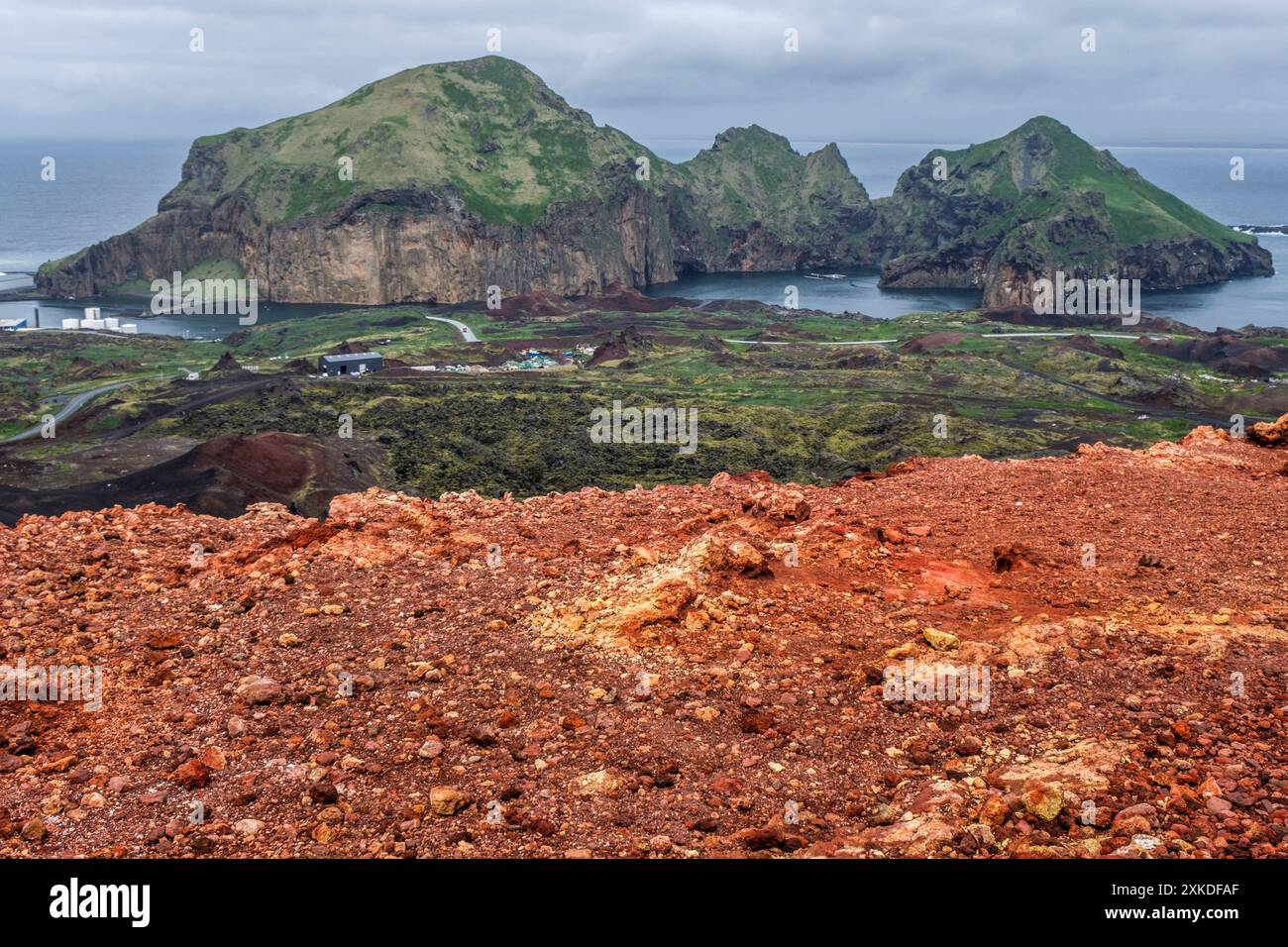 The city of Heimaey and the haven are located at the foot of the ...