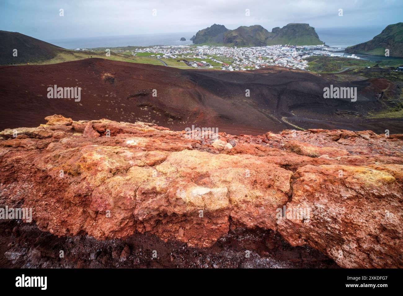 The city of Heimaey and the haven are located at the foot of the ...