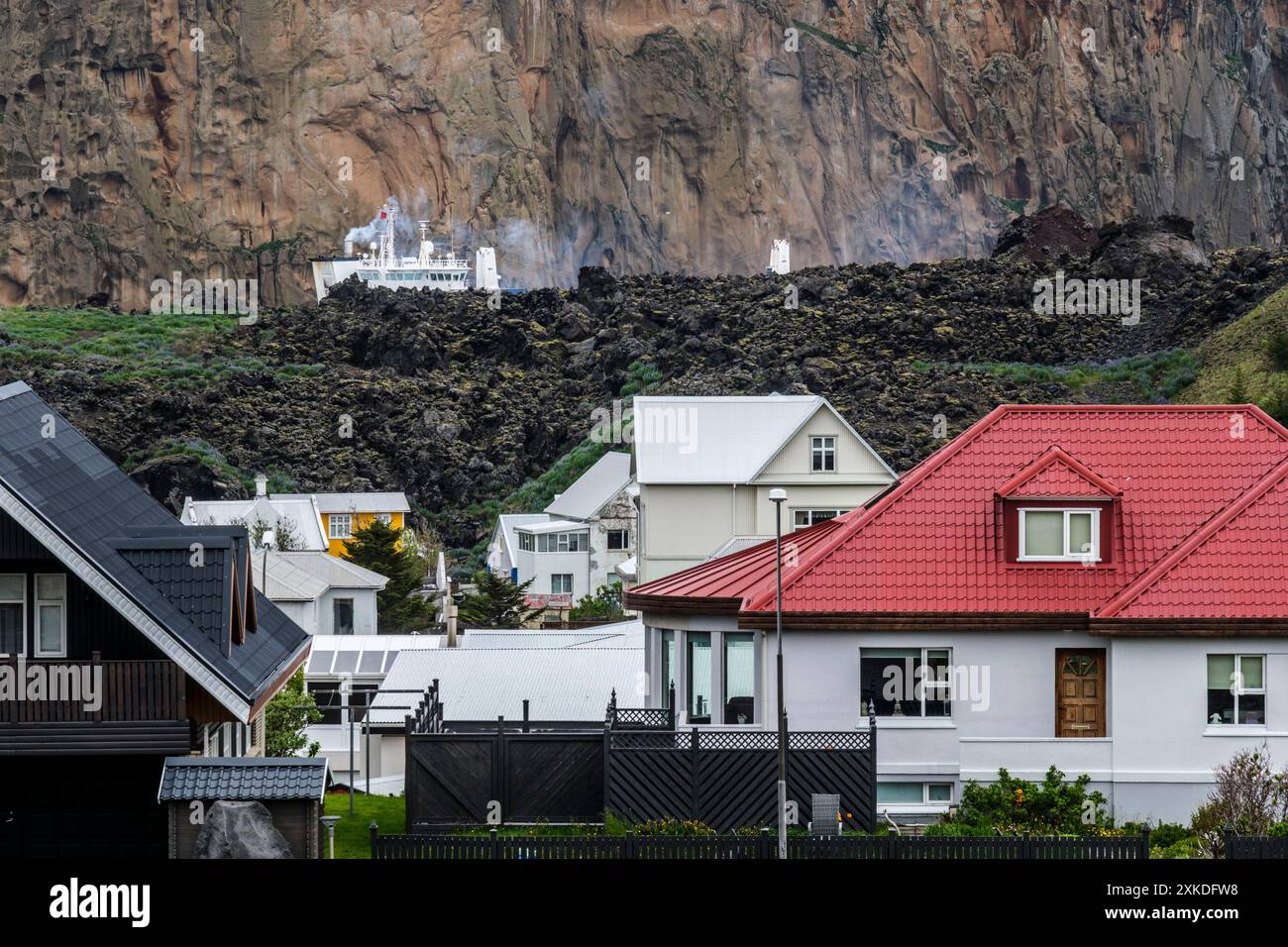 The city of Heimaey and the haven are located at the foot of the ...