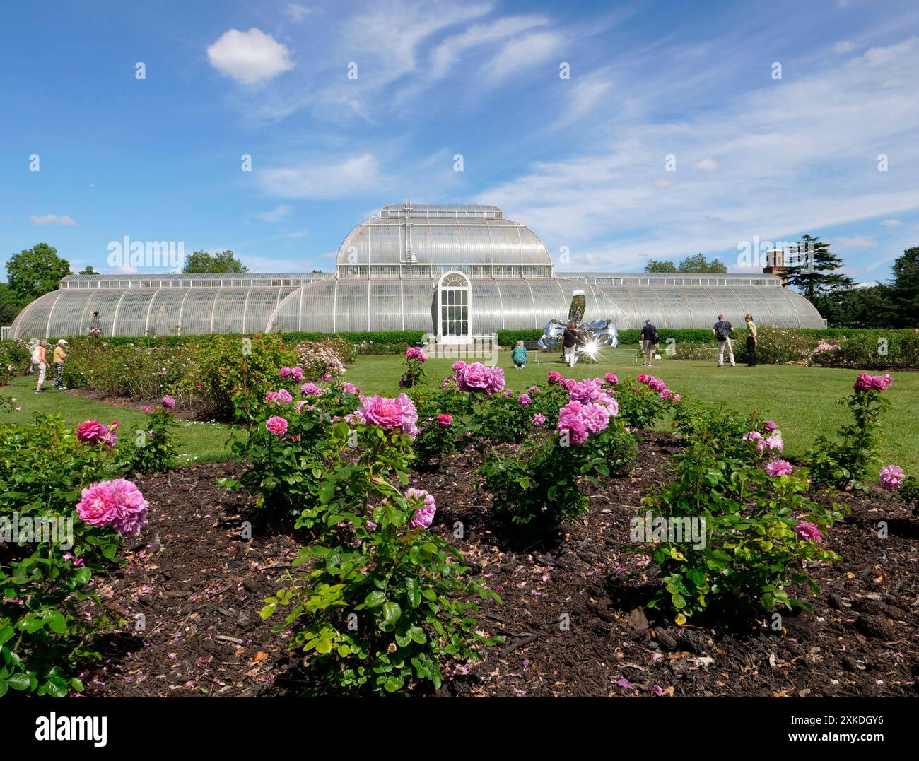 Rose garden with tourists admiring the light into life sculpture, Palm ...