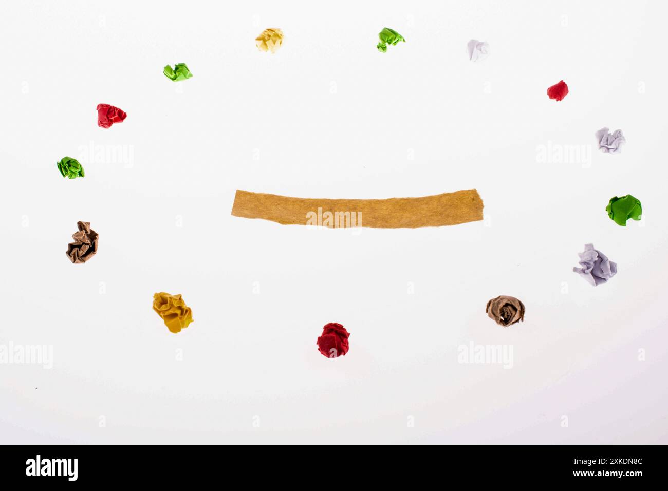 Colorful crumpled papers form a round shape on white background Stock ...