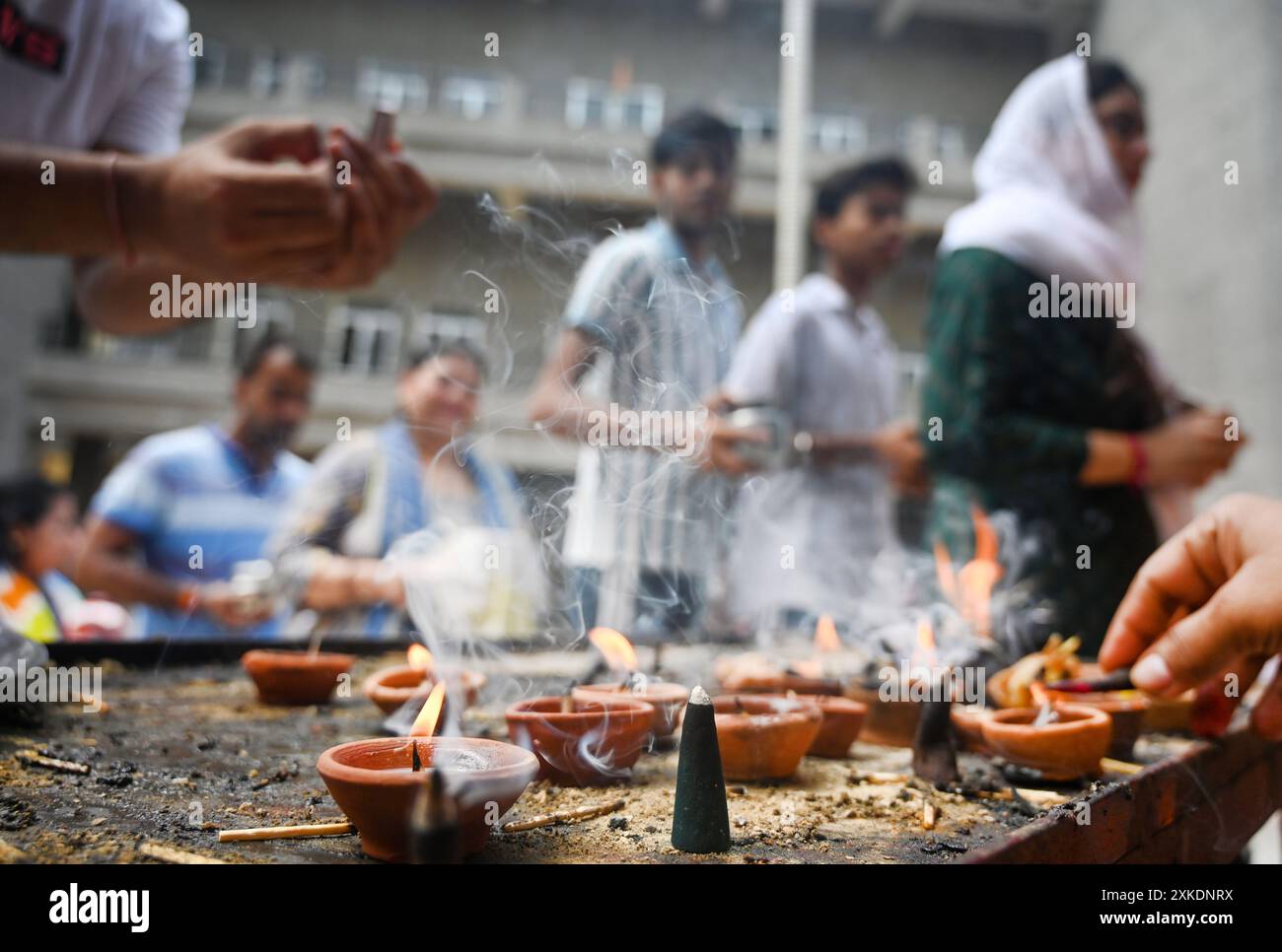 NOIDA, INDIA - JULY 22: Devotees perform rituals on the first Monday of ...