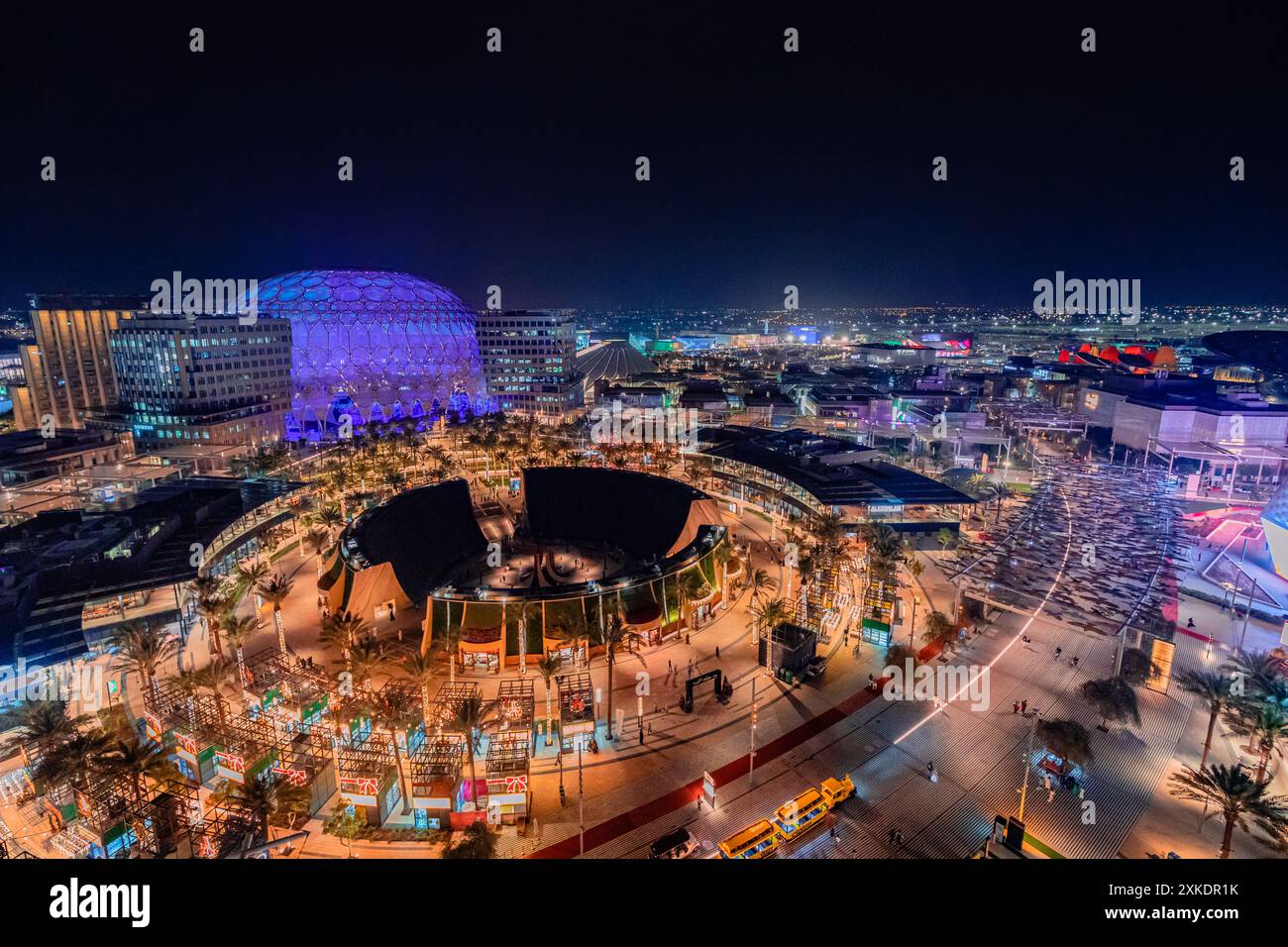 An aerial view of Expo 2020 Dubai at night, showing the illuminated ...