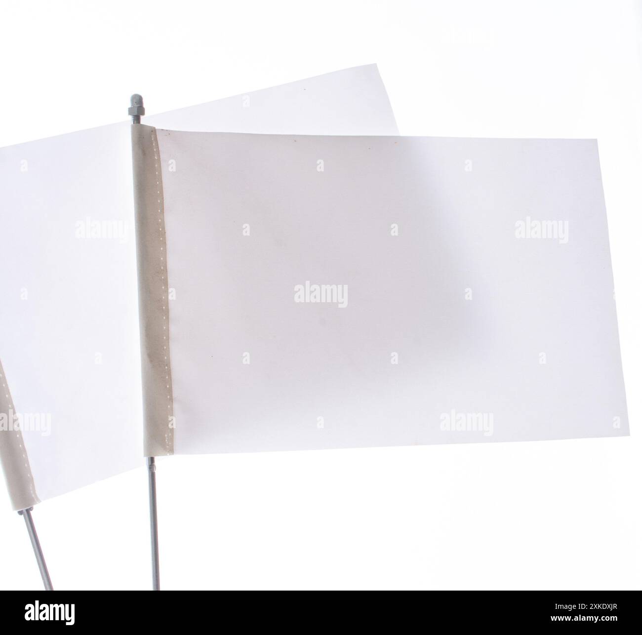 Two white flags on a white background in the display Stock Photo - Alamy
