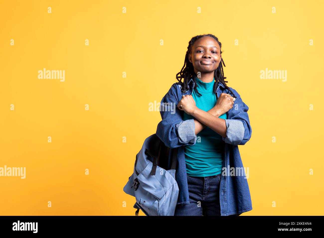 Assertive african american woman shows letter X with arms crossed ...