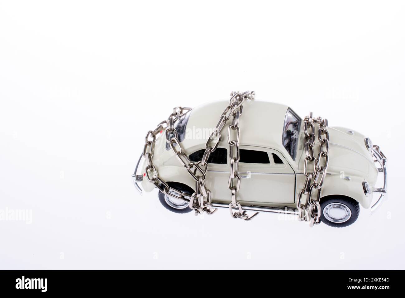 Chained white car on white background Stock Photo - Alamy