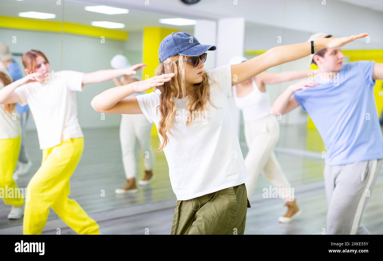 Group of cheerful, talented and active tween dancers forming straight ...