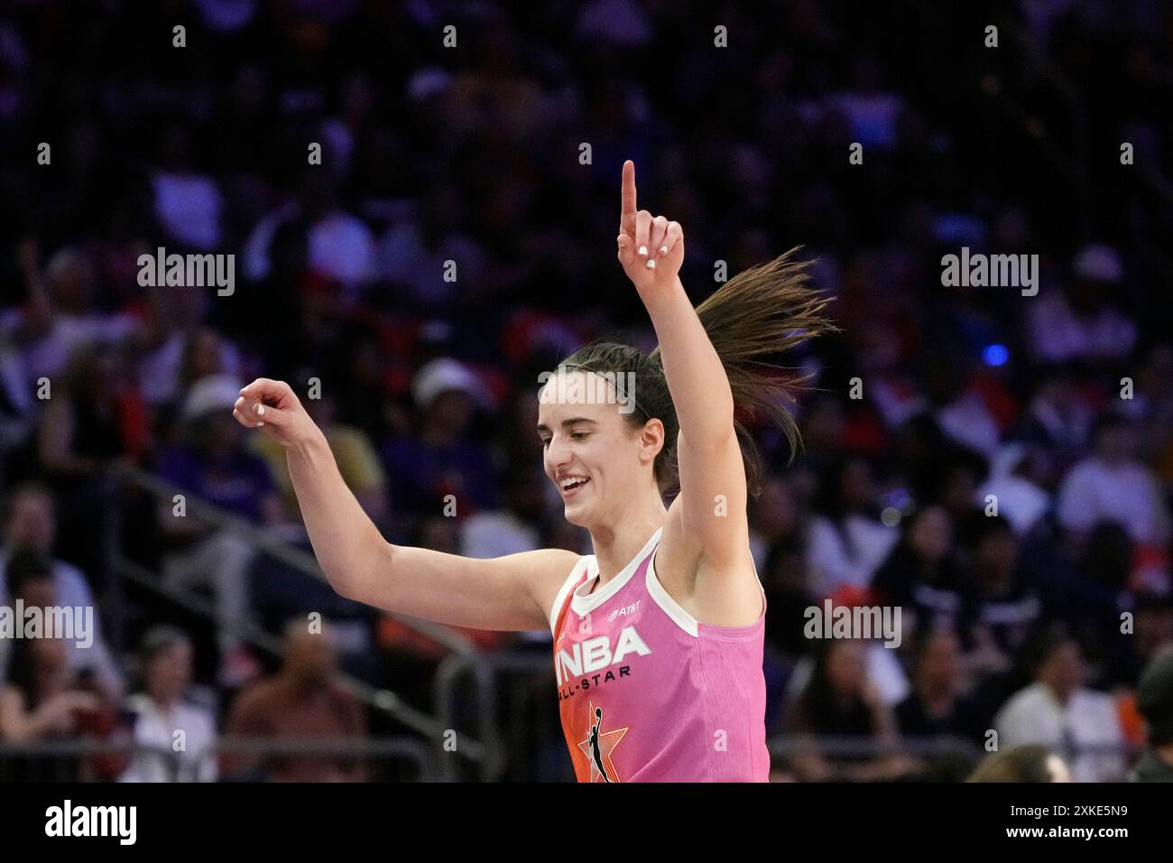 Caitlin Clark, of Team WNBA, reacts after shooting a 3-pointer against Team USA during the first ...