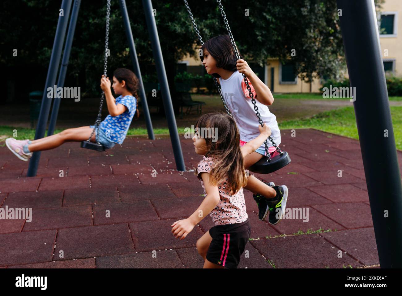 Three girls in playground hi-res stock photography and images - Alamy
