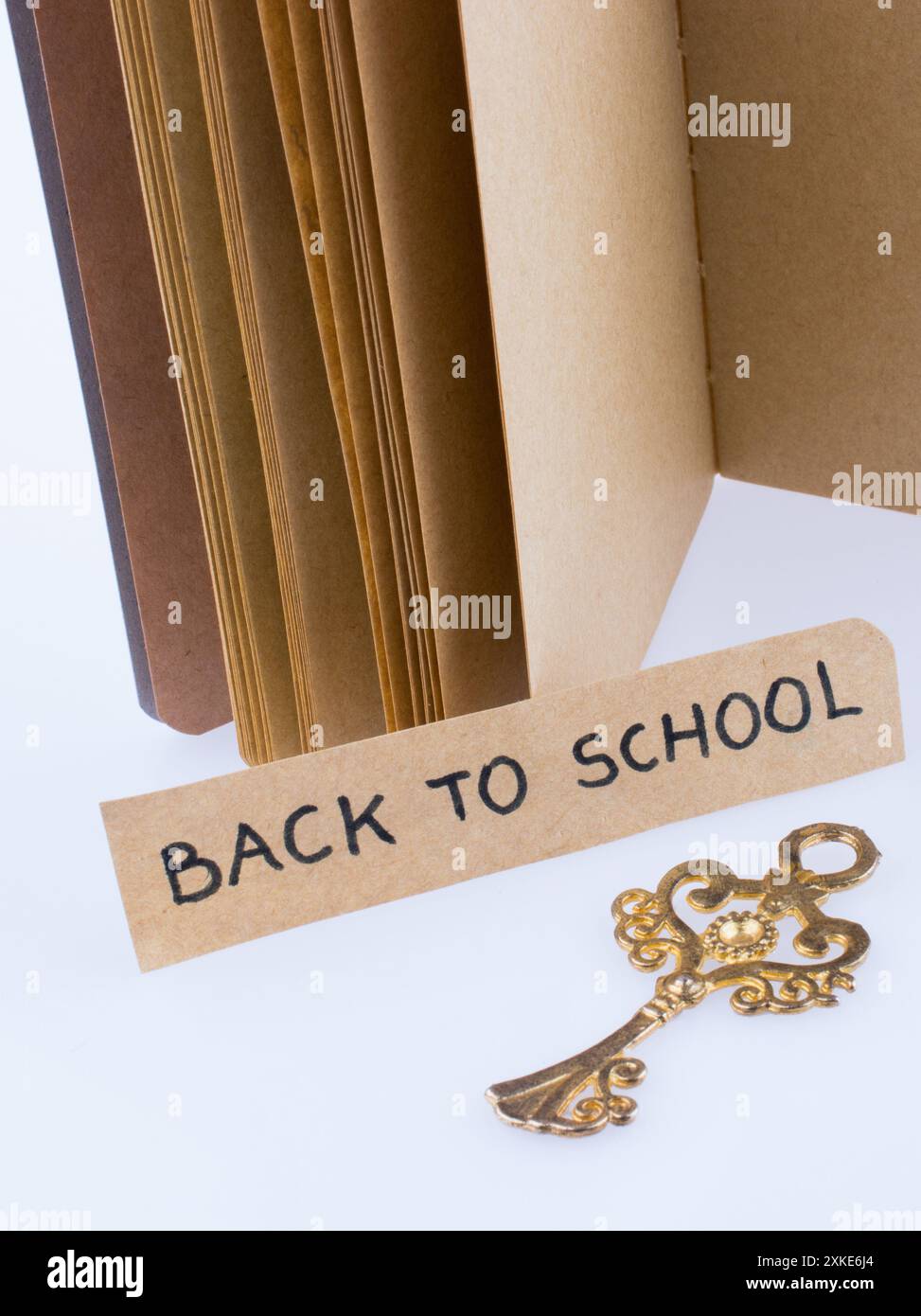 Notebook, key and and back to school title on a notebook Stock Photo ...