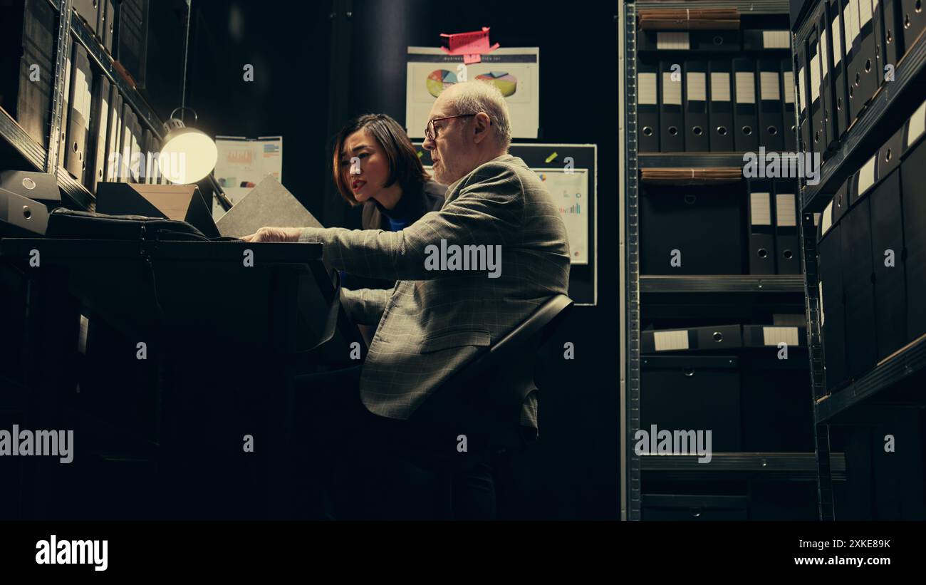 Investigators studying historical maps of crime scenes using federal ...