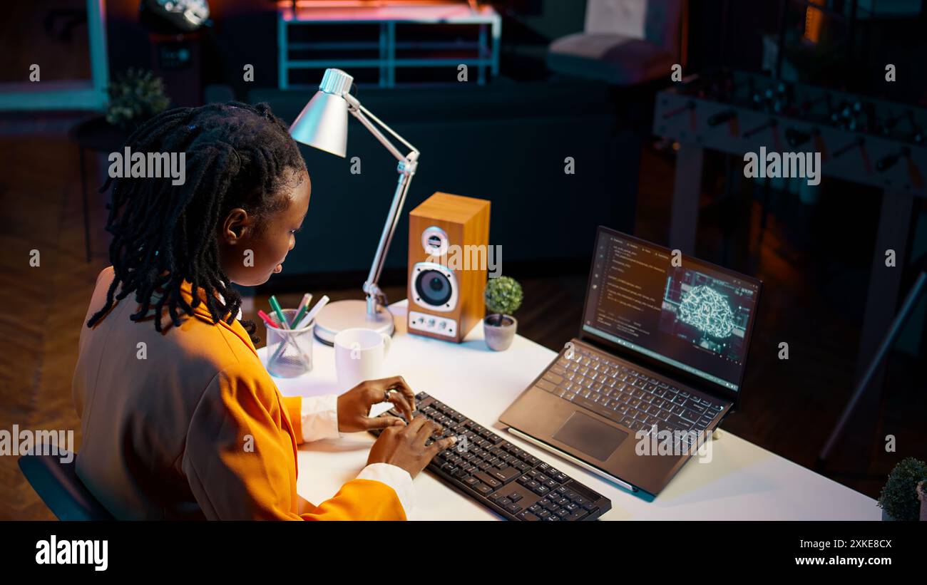 IT student works with artificial intelligence brain system on laptop ...