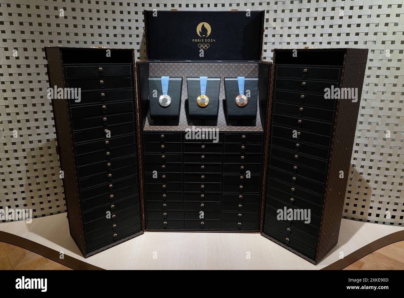 A monogrammed trunk designed to protect and display the Olympic medals ...