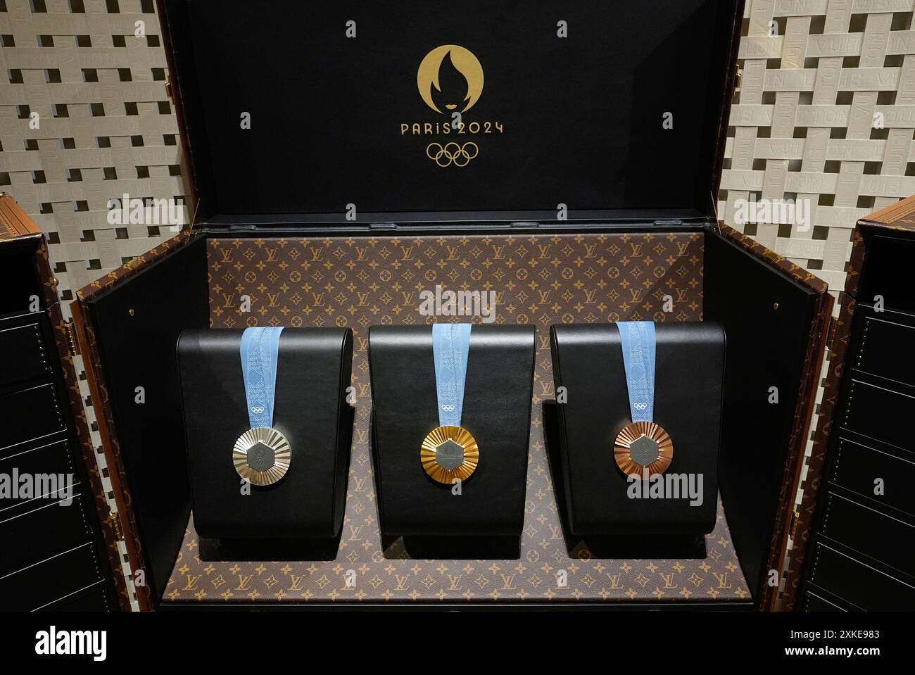 A monogrammed trunk designed to protect and display the Olympic medals ...