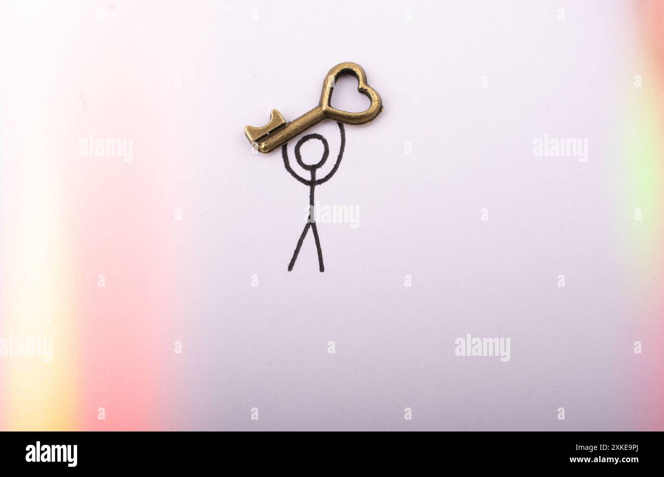 Man carrying a heart shaped key on white background Stock Photo - Alamy