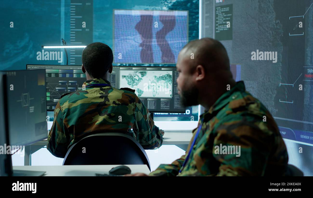US soldiers in a high tech command center protecting classified ...