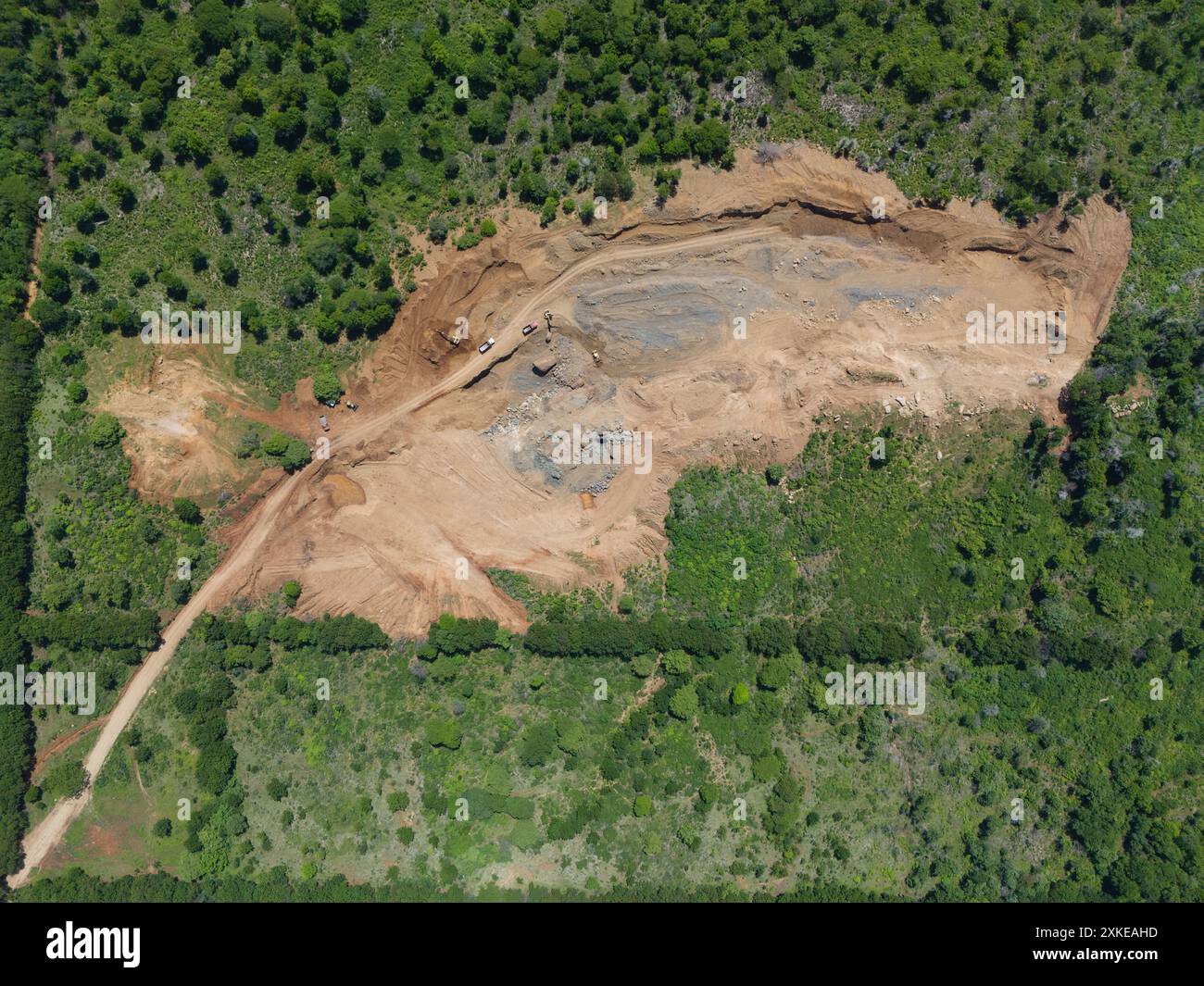 Big mining quarry in green forest above top view Stock Photo - Alamy