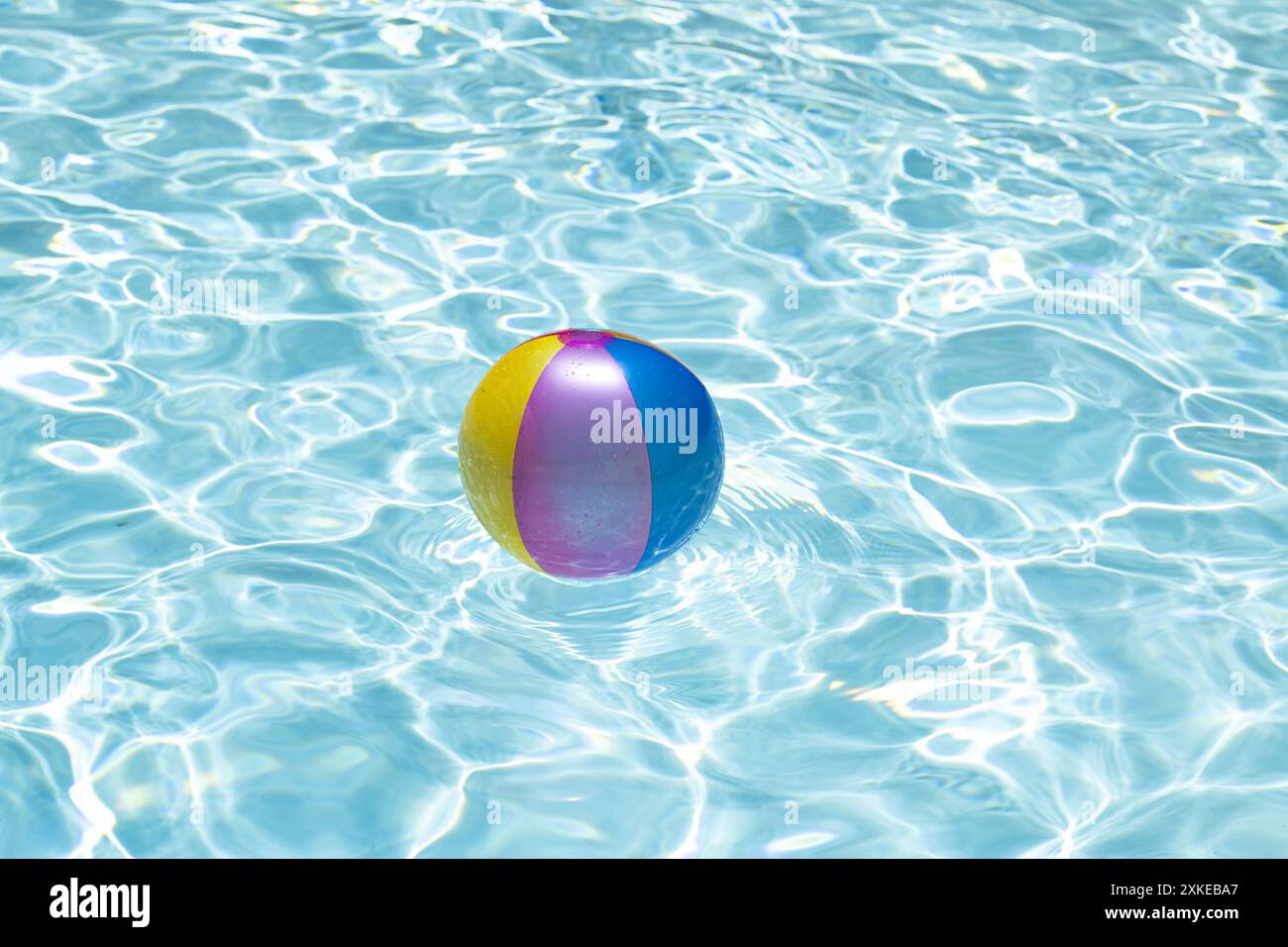 Pool floats. Beach ball in swimming pool. Summer background. Colorful ...