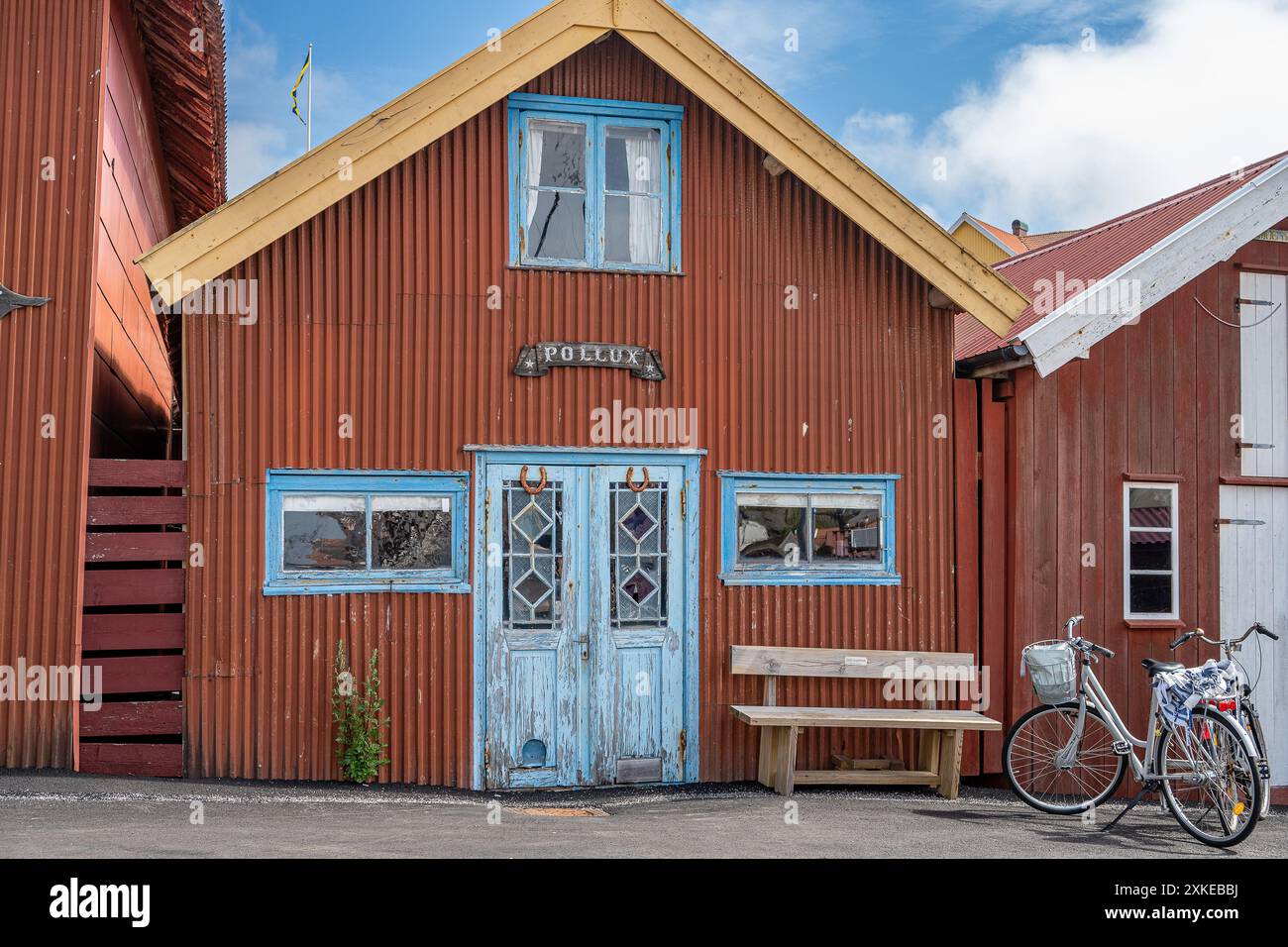 Traditional buildings at the Eastern harbour in Grundsund, which is a ...