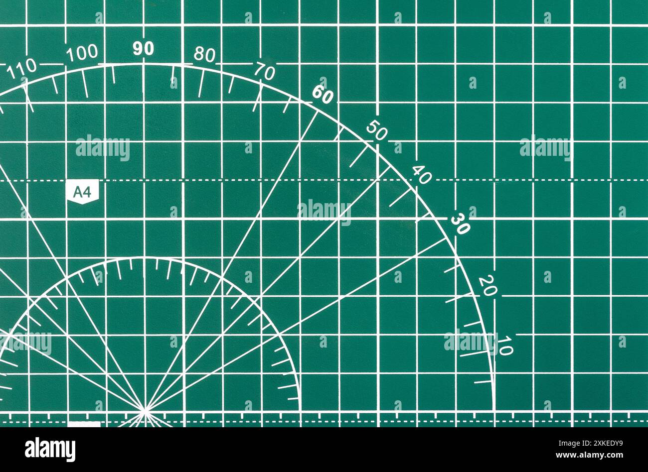 Photo of green colored cutting mat tool with ruler and angles Stock ...