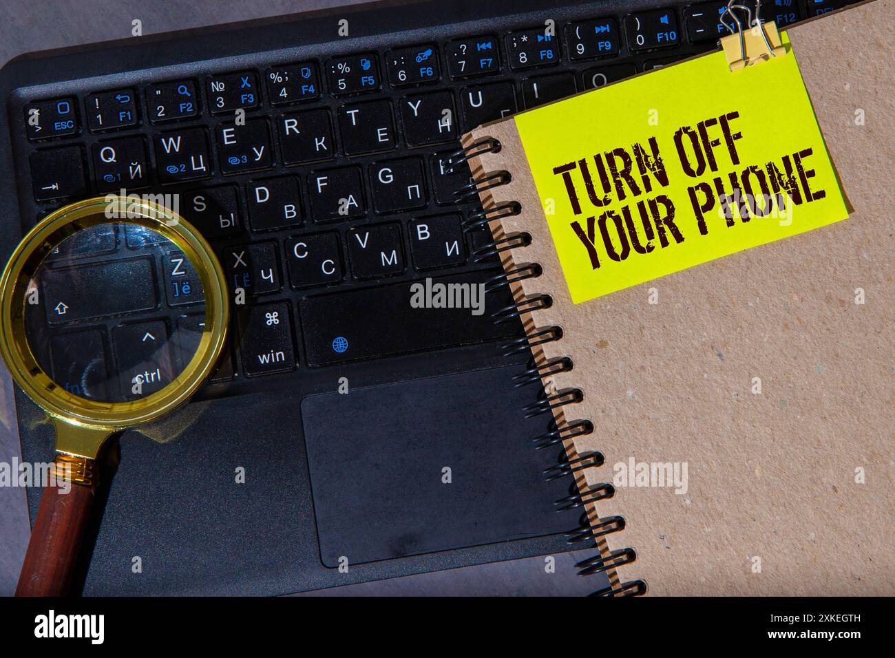 Business man pointing the text Turn Off Your Phone Stock Photo - Alamy