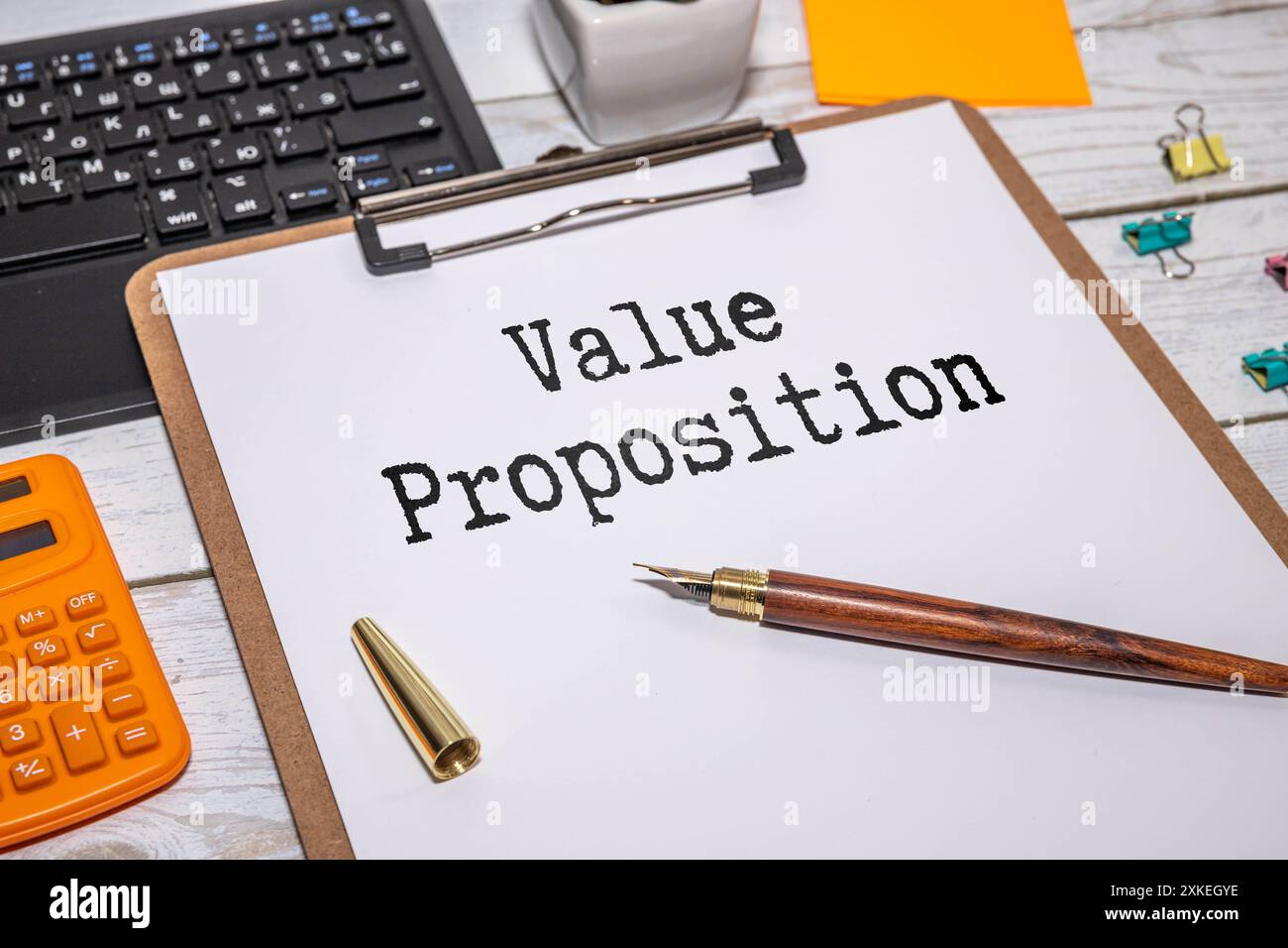 Value Proposition text message with calculator and magnifying top view ...