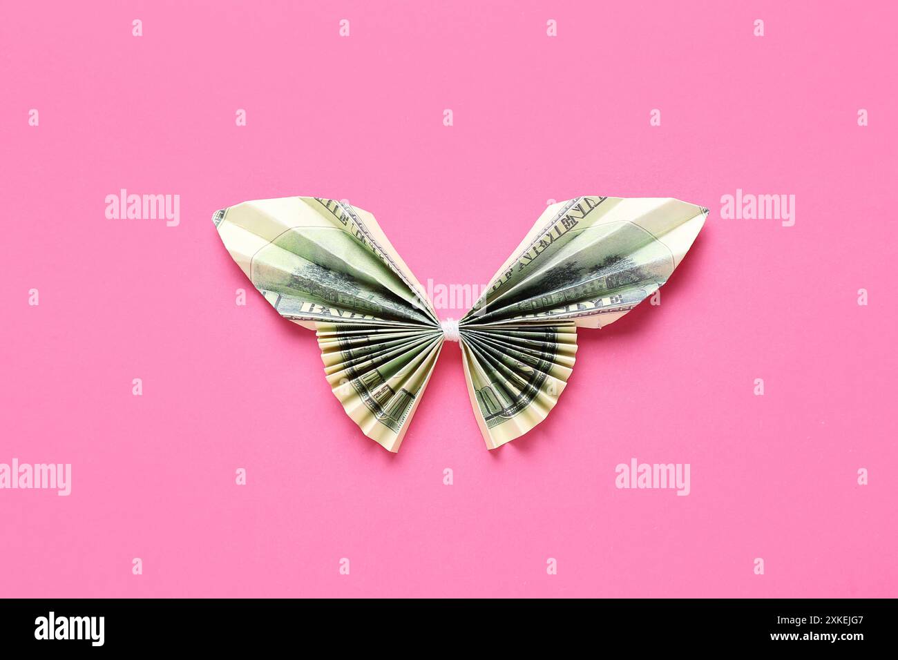 Origami butterfly made of dollar banknotes on pink background Stock ...