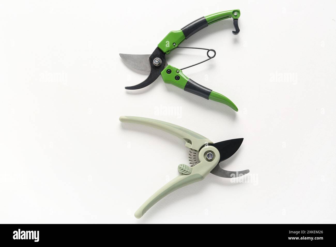 Different secateurs on white background Stock Photo - Alamy