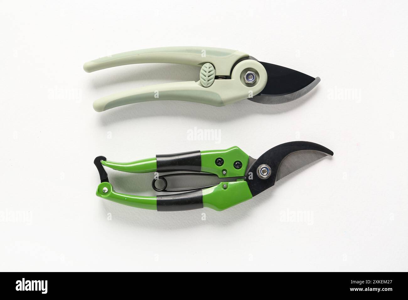 Different secateurs on white background Stock Photo - Alamy