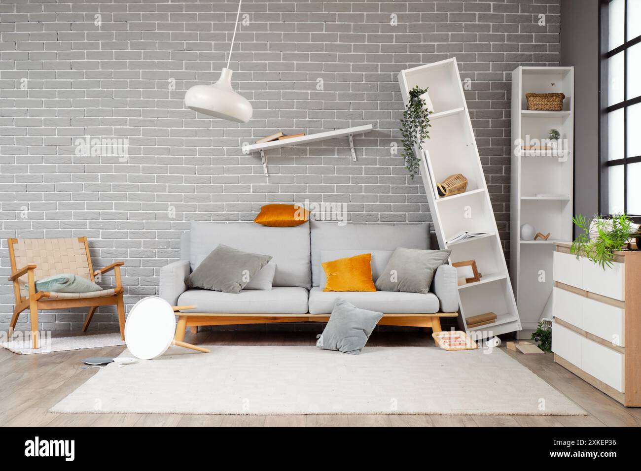 Interior of messy living room with overturned furniture after ...