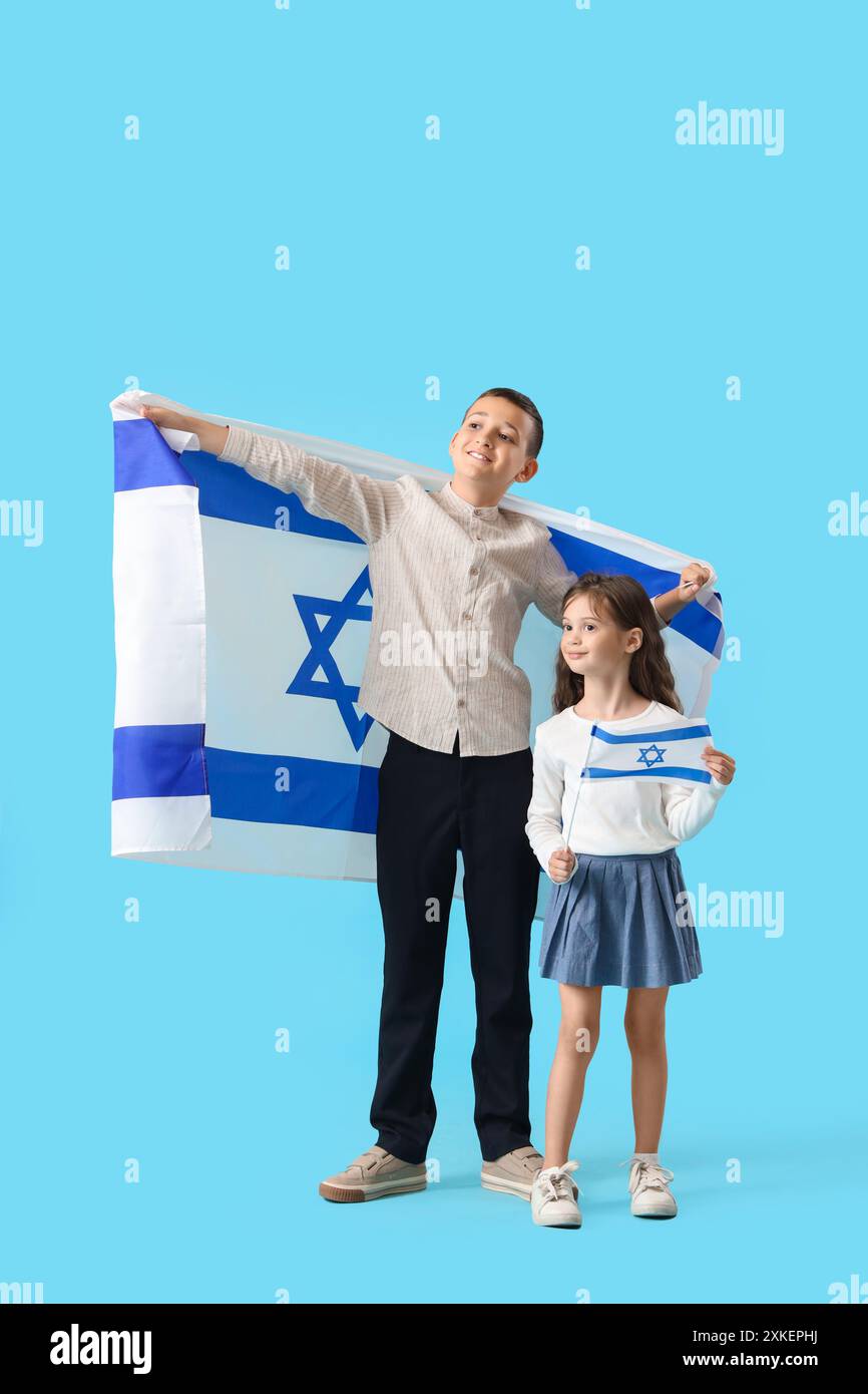 Little Jewish children with flags of Israel on blue background Stock ...