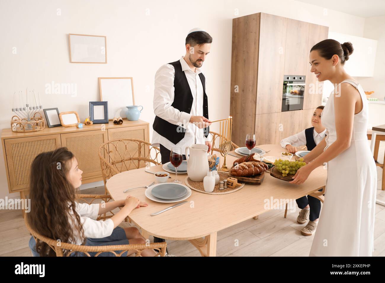 Happy Jewish family having dinner at home Stock Photo - Alamy