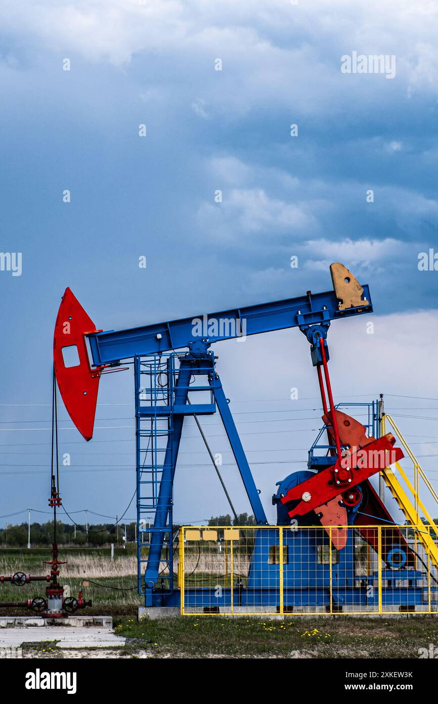 Oil drilling derrick pumps oil from ground. Petroleum industry, crude oil extraction. Production ...