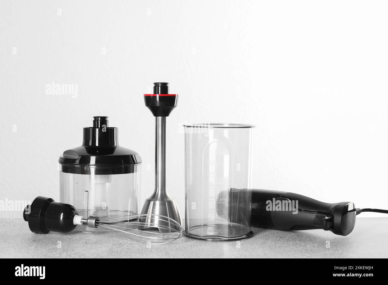 Hand blender kit on gray table against white background Stock Photo - Alamy